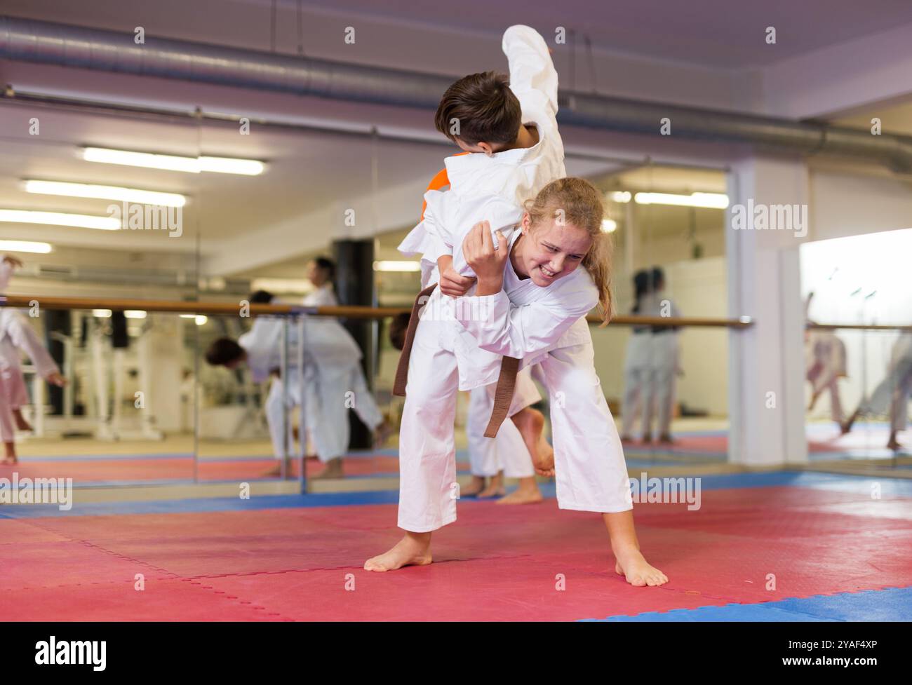 Group of children doing karate kicks during karate class Stock Photo ...