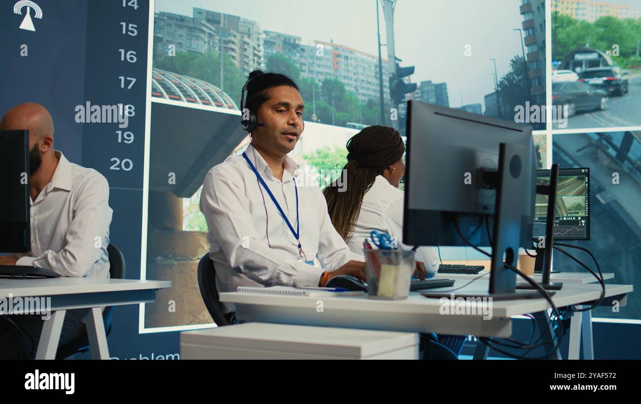 Indian Employee Communicating Satellite Map Directions In Observation Room Monitoring Traffic