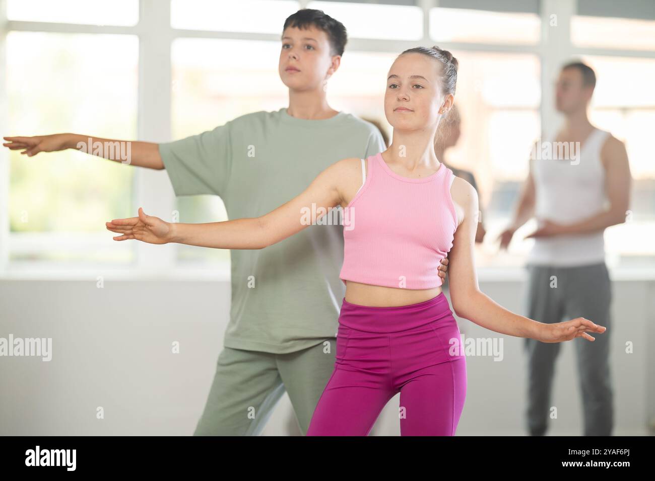 Boy and girl in pair train to perform ballet dance during rehearsal in ...