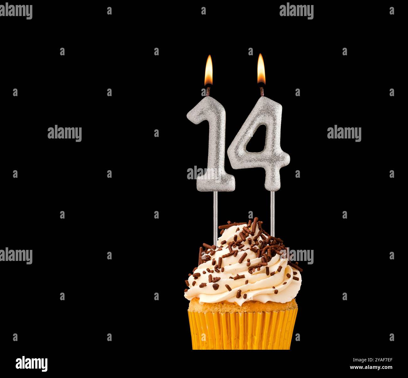 Number 14 shaped candles - Birthday cupcake on black background Stock ...