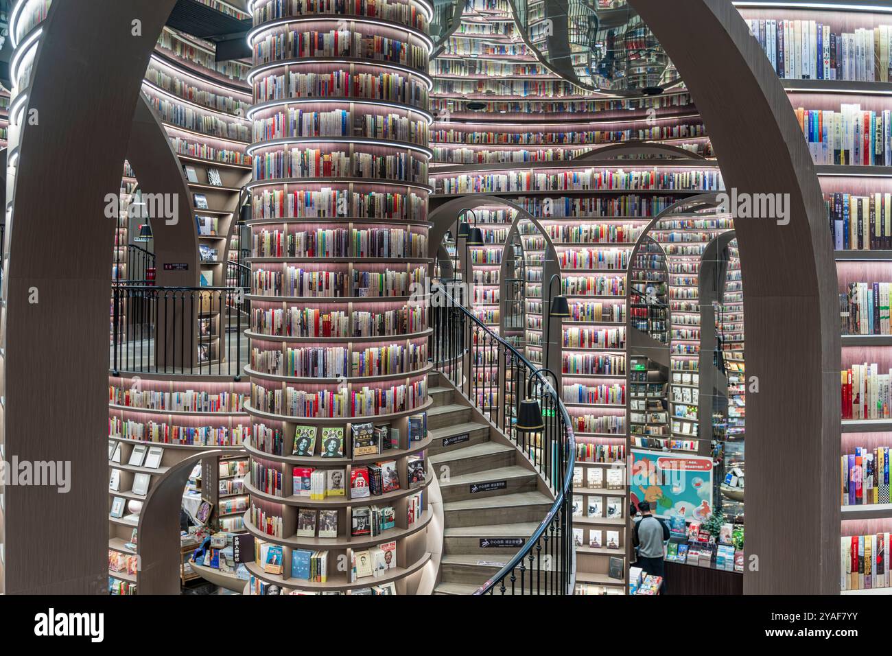 CHENGDU, CHINA - OCTOBER 13, 2024 - Visitors read books at Zhongshuge ...