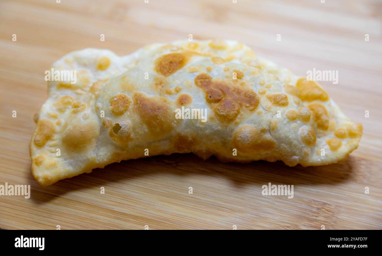 Traditional rustic Brazilian pastry, fried and stuffed with ground beef ...