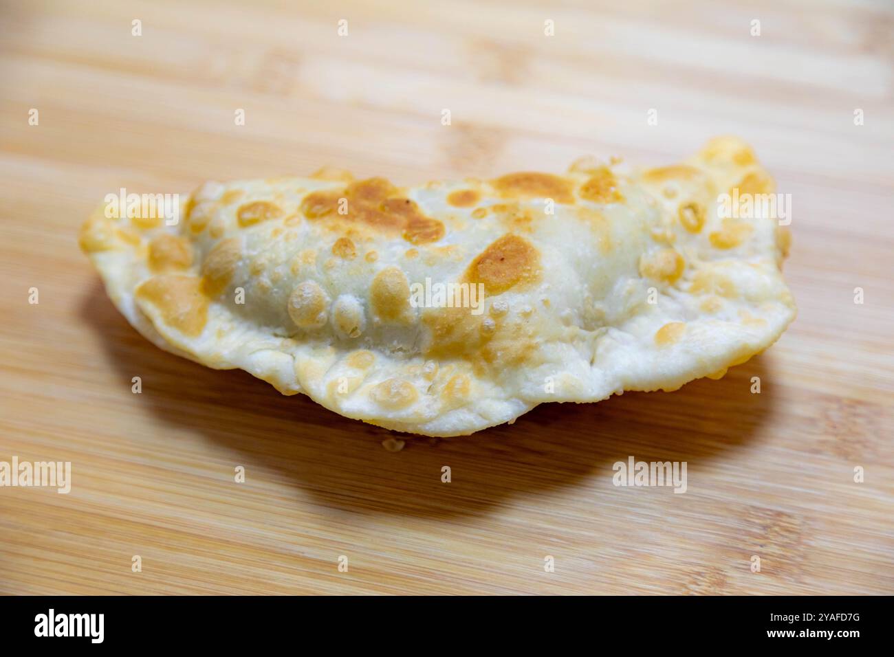 Traditional rustic Brazilian pastry, fried and stuffed with ground beef ...