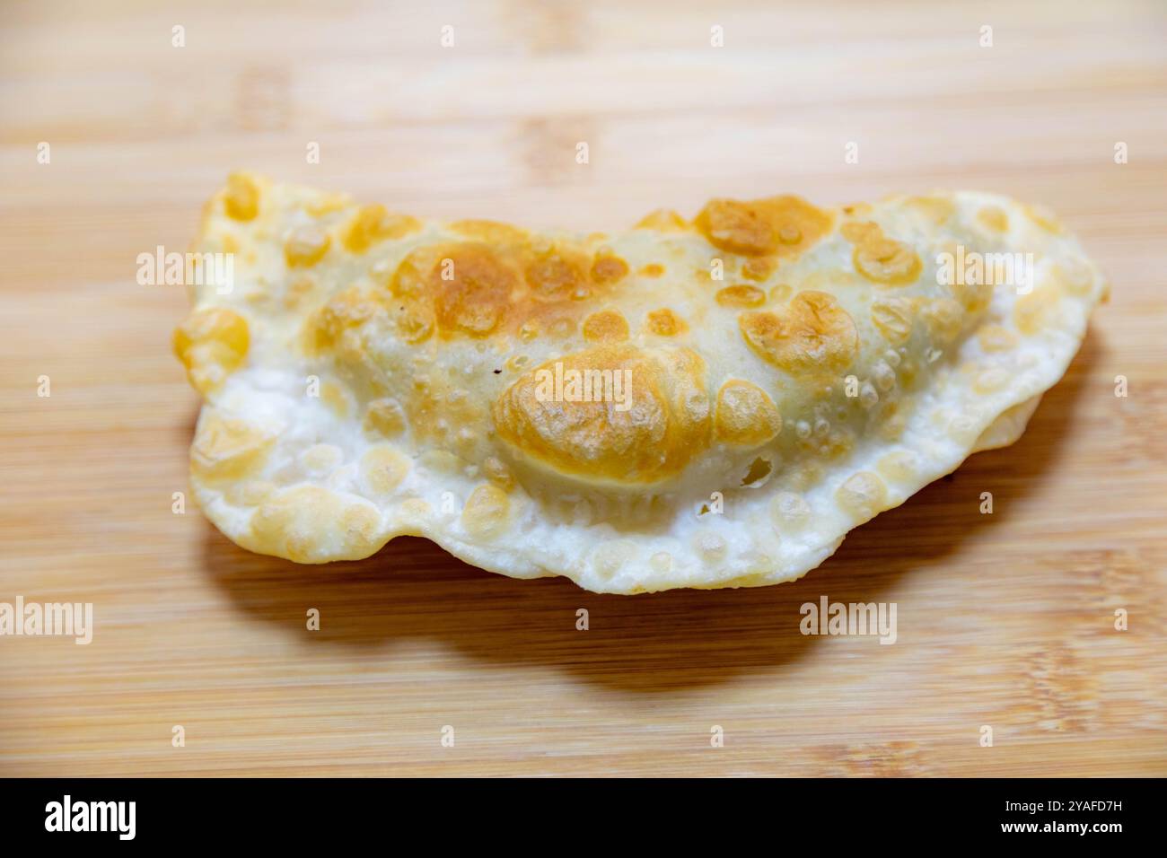 Traditional rustic Brazilian pastry, fried and stuffed with ground beef ...