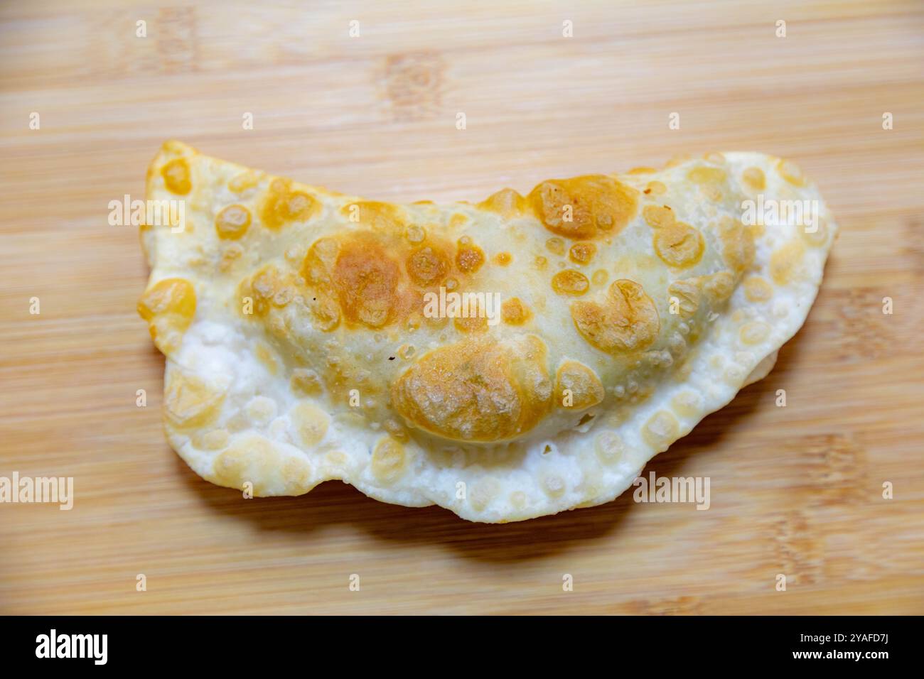 Traditional rustic Brazilian pastry, fried and stuffed with ground beef ...