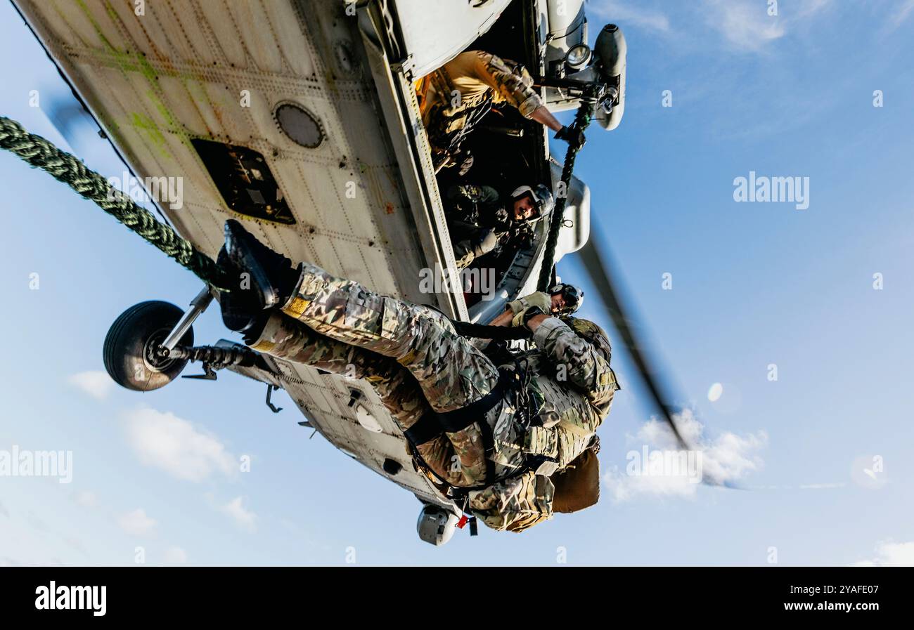 A Sailor assigned to Explosive Ordnance Disposal Mobile Unit (EODMU) 5 ...