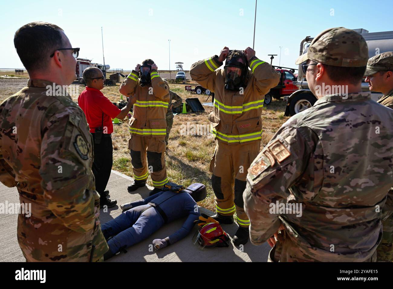 Airmen from the 97th Civil Engineer Squadron (CES) assist the 97th ...