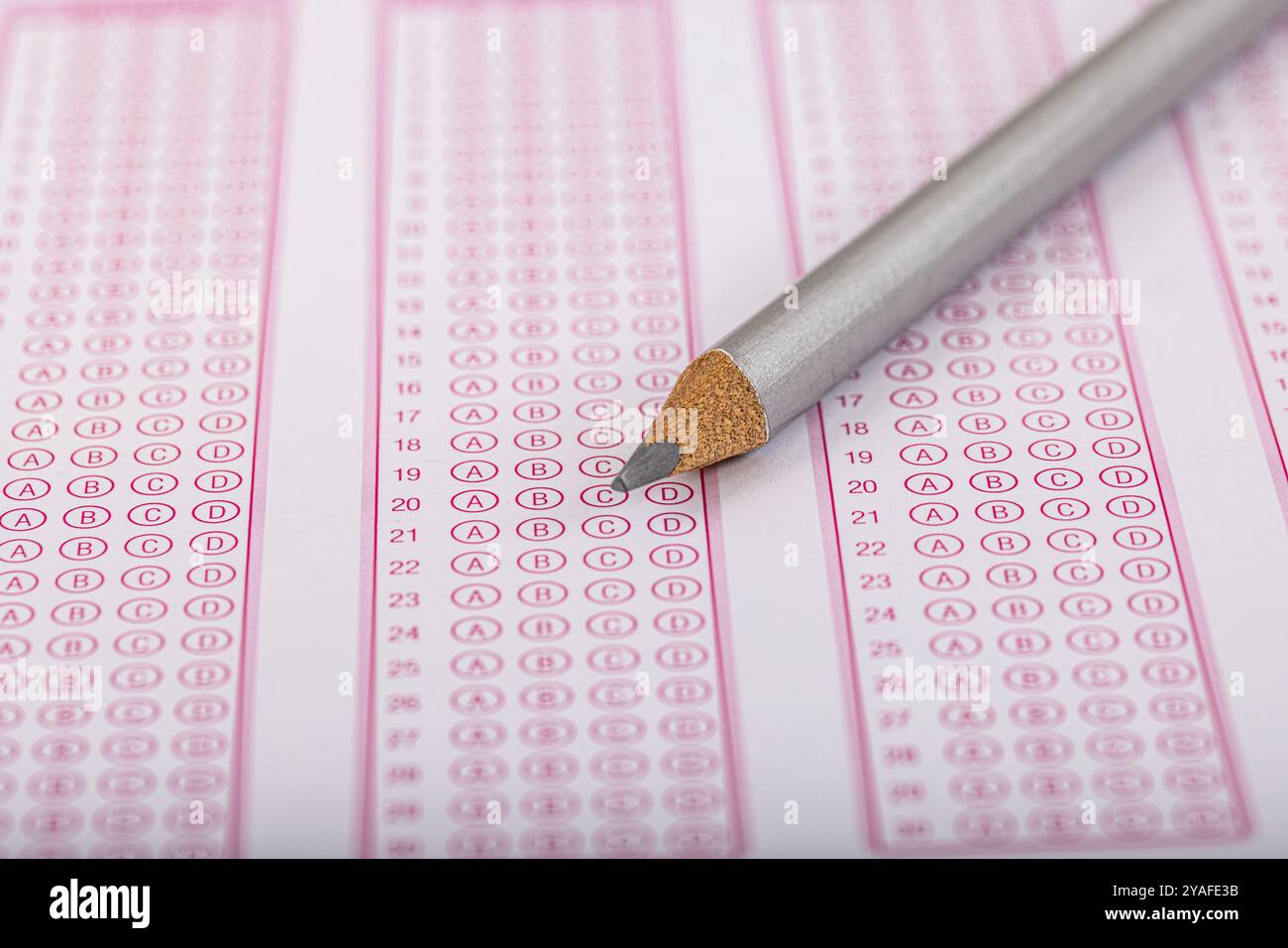 Exam, a hand taking an exam with a pen on an optical reader. Exam, an ...