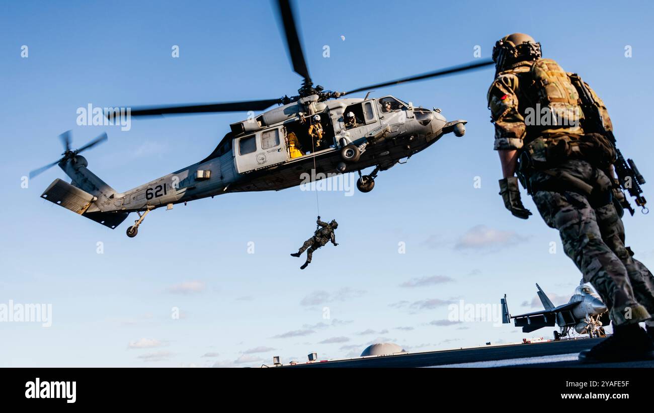 A Sailor assigned to Explosive Ordnance Disposal Mobile Unit (EODMU) 5 ...