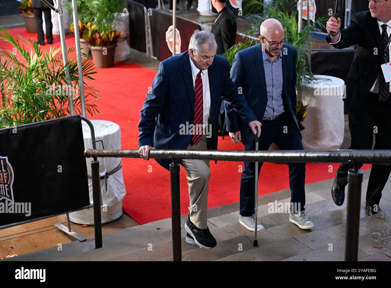 Jim Calhoun, left, arrives with his son Jeff, second from left, at the ...
