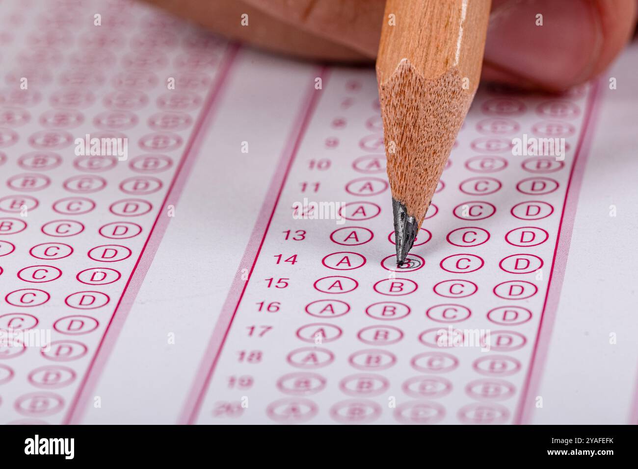 Exam, a hand taking an exam with a pen on an optical reader. Exam, an ...