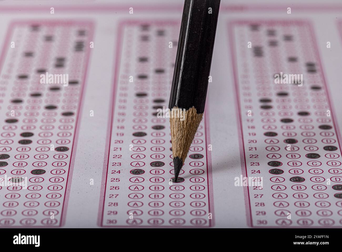 Exam, a hand taking an exam with a pen on an optical reader. Exam, an ...