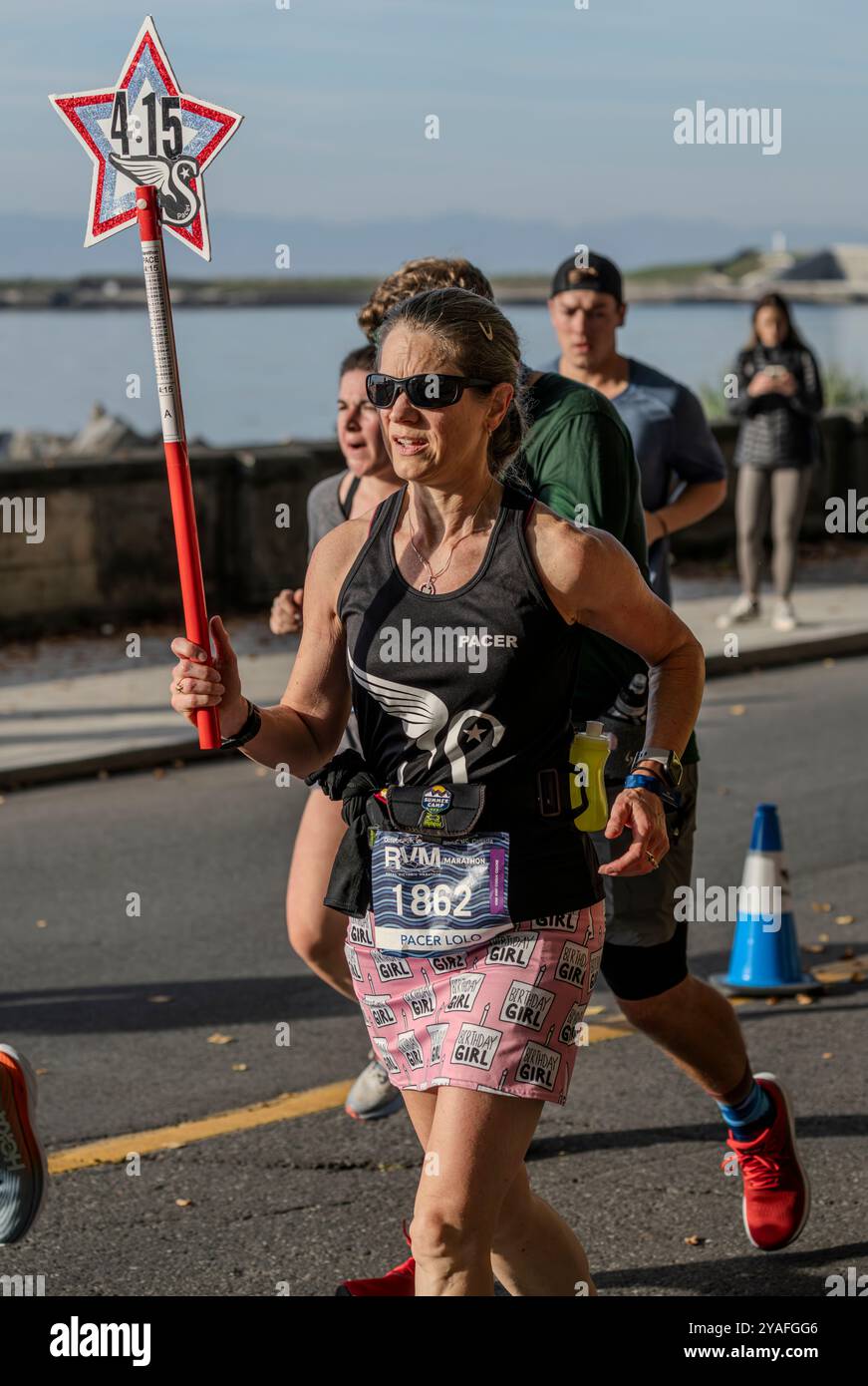 A pace runner in the Royal Victoria Marathon on Dallas Road at Ross Bay ...