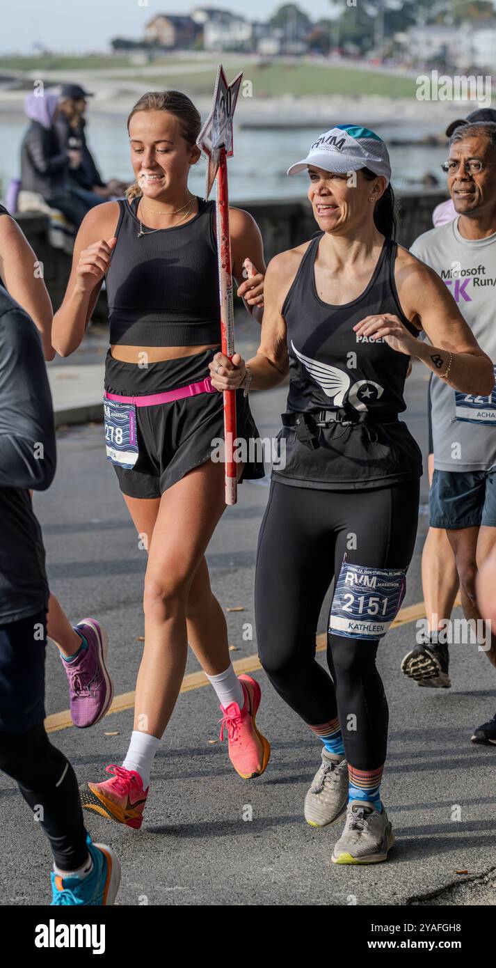 A pace runner in the Royal Victoria Marathon on Dallas Road at Ross Bay ...