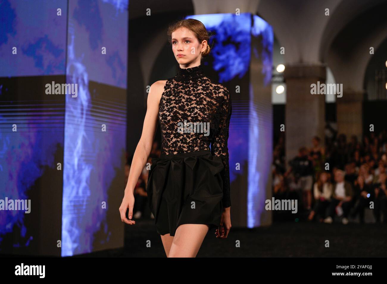 A model walks the runway during the Dino Alves fashion show at ...
