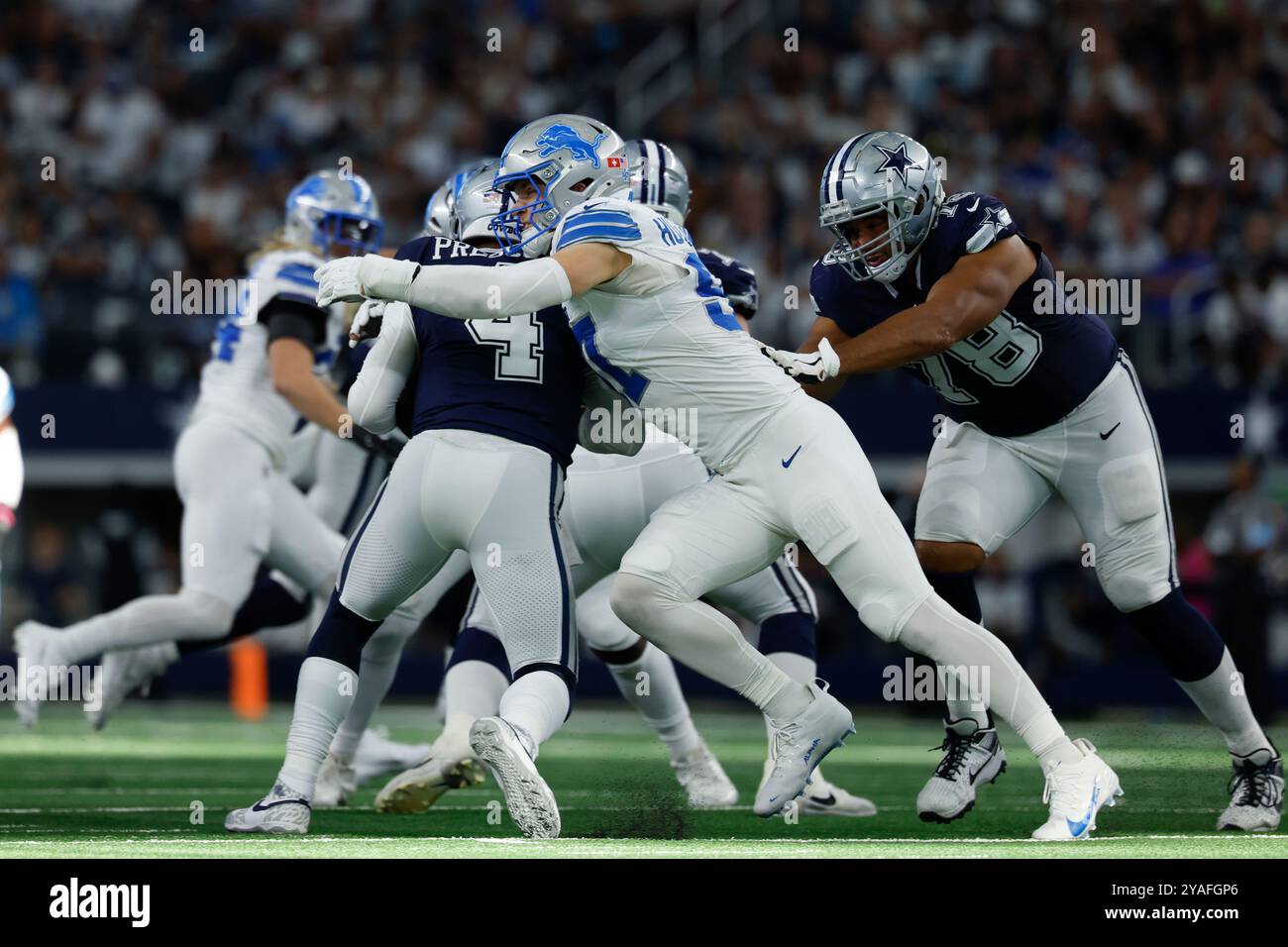 Detroit Lions defensive lineman Aidan Hutchinson (97) sacks Dak Prescott (4) during an NFL ...