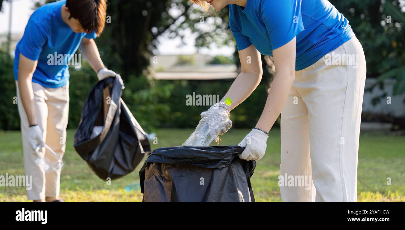 Enthusiastic Volunteers Collecting Litter in a Park to Promote ...
