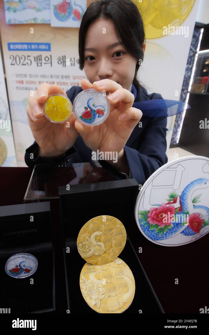 14th Oct, 2024. Medals marking Year of Snake An official shows off ...