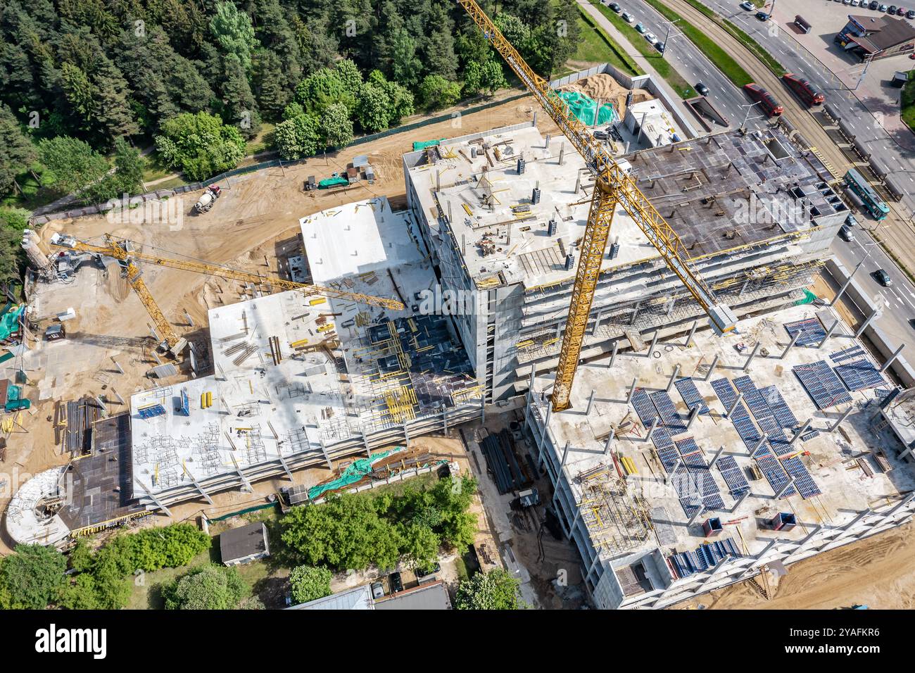 urban construction site with working cranes. new commercial building ...