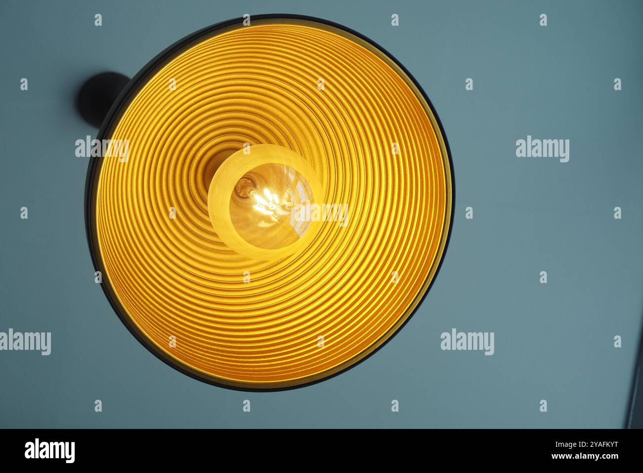 This is a modern yellow ceiling light fixture that features an elegant ...