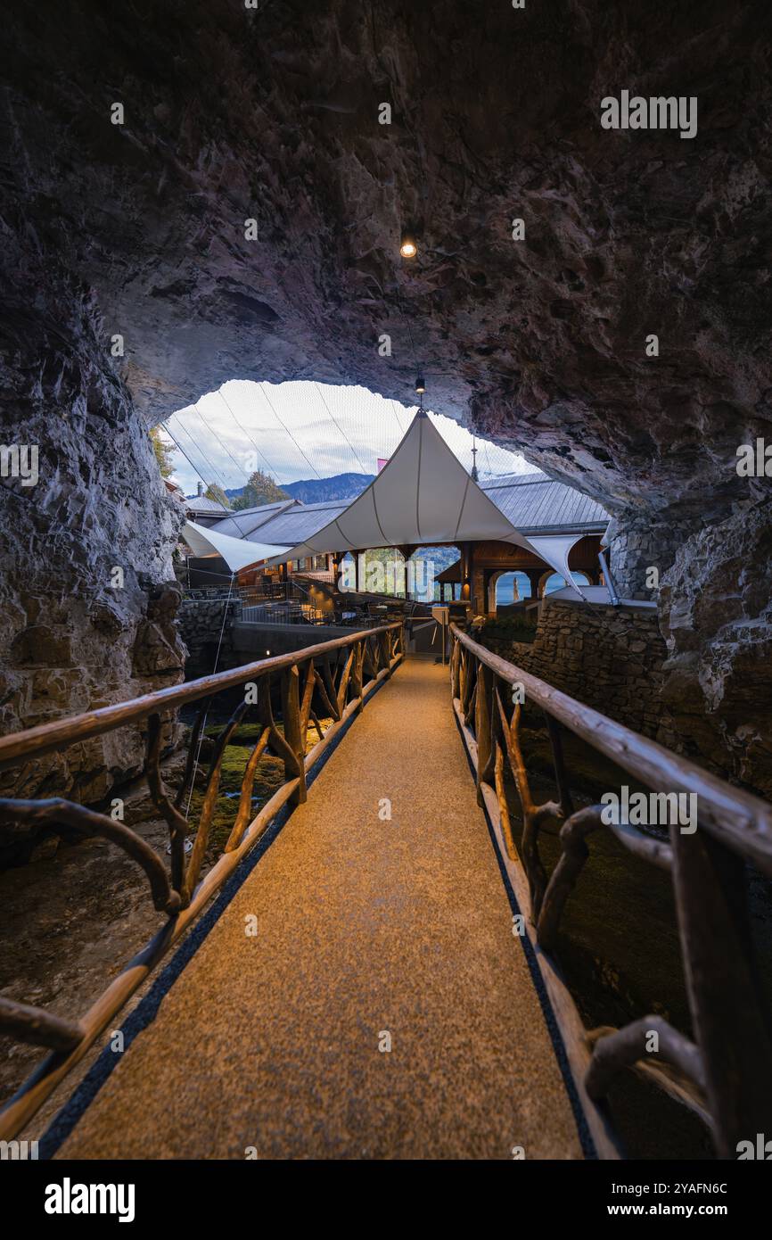 Rustic bridge in an illuminated cave restaurant with natural flair, St ...