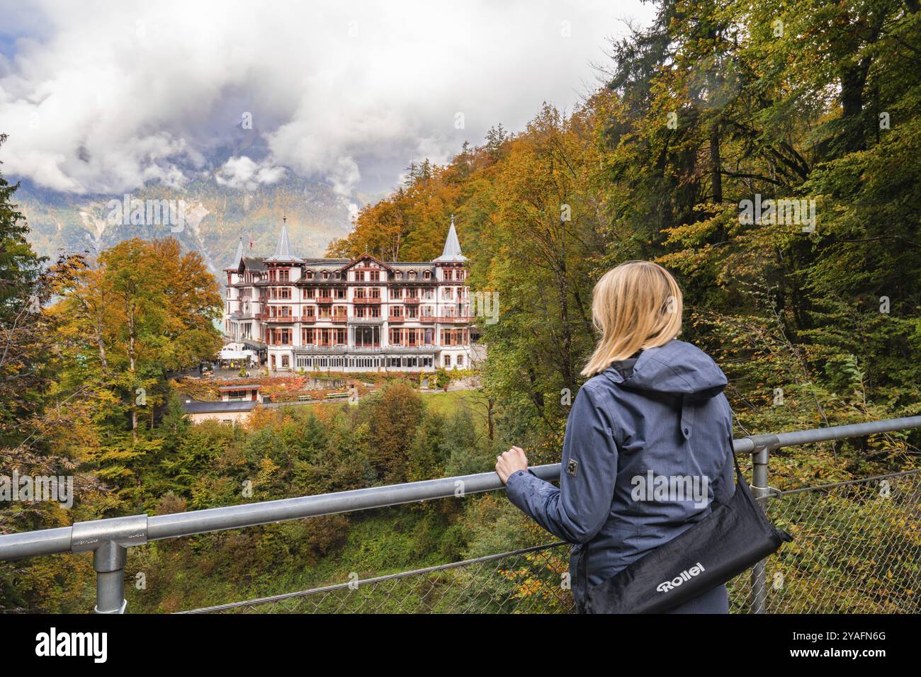 Woman looks waterfall from forest hi-res stock photography and images ...