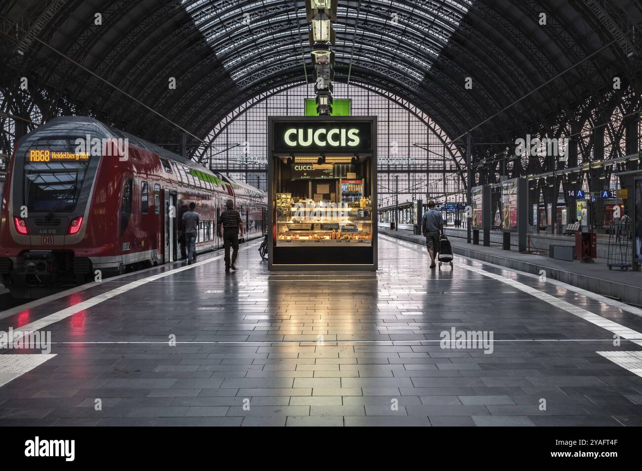 Germany, 23.07.2018: Travellers walk to a waiting local train on the ...