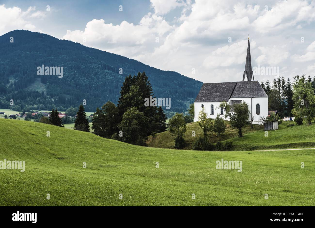 Scenic view of a chapel and green hills over the German countryside in ...