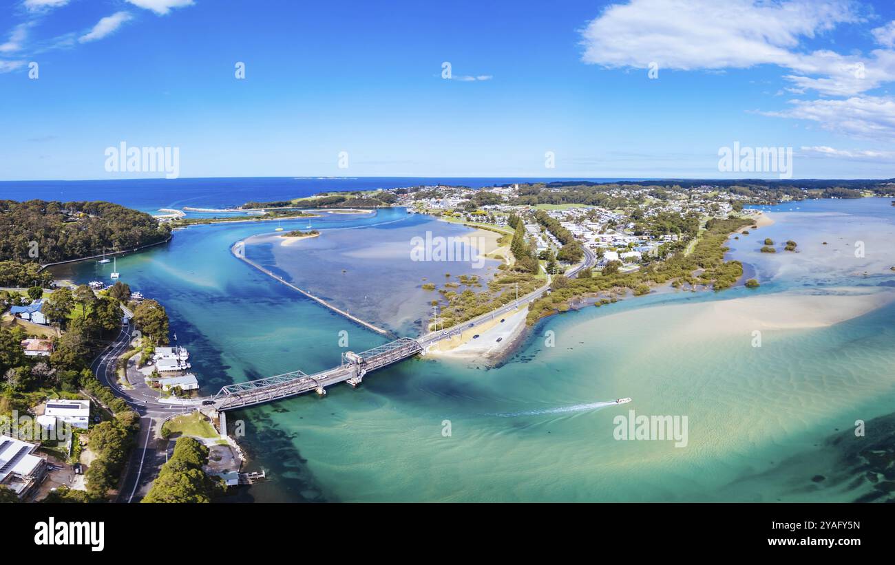 Aerial view of the idyllic coastal town of Narooma wrapped around the ...