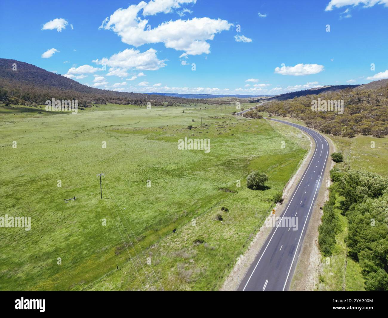 The view towards Crackenback over the Alpine Way road on a warm sunny ...