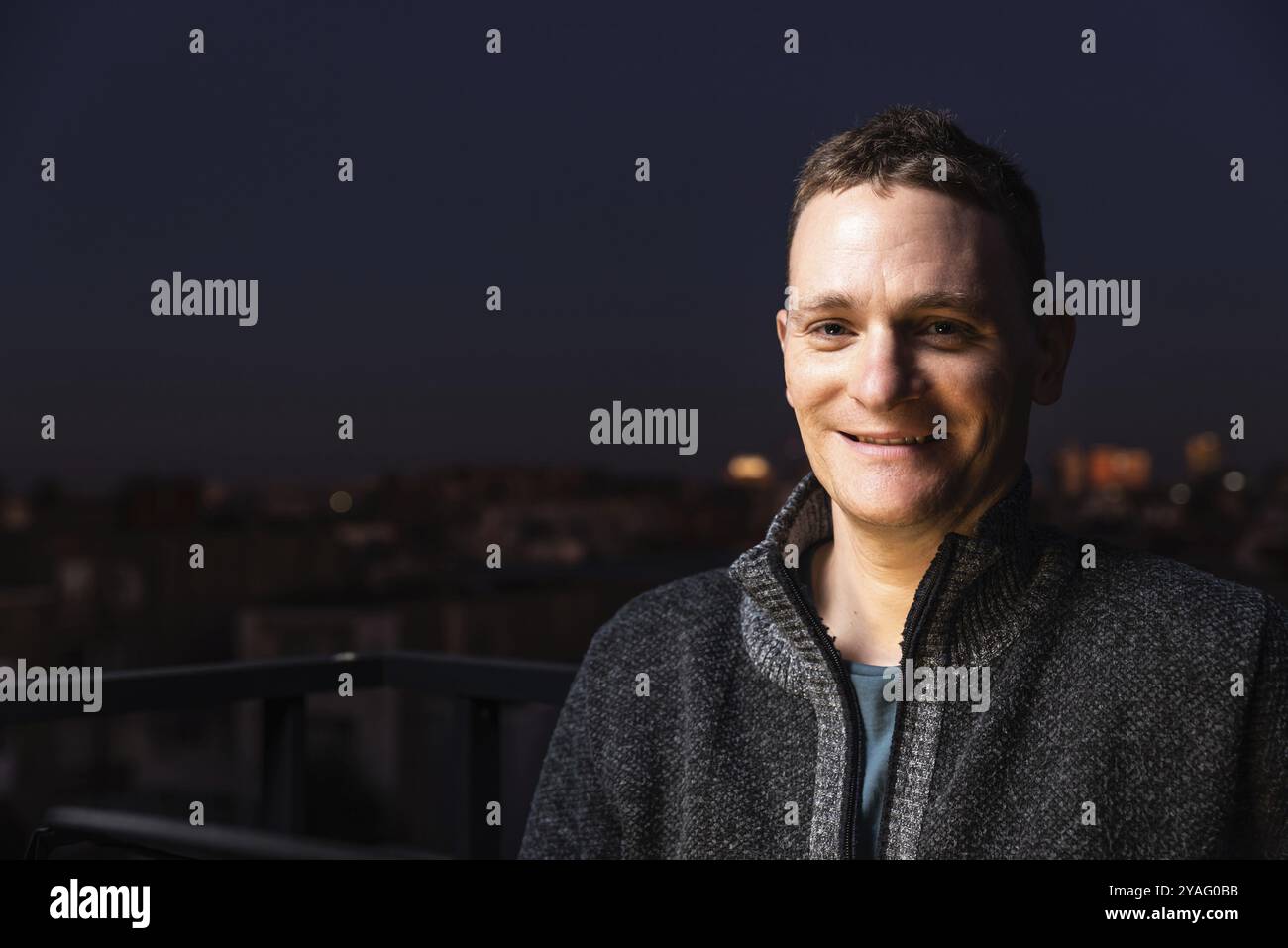 Attractive forty year old white man making a selfportrait at night ...