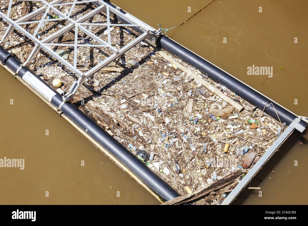 Garbage Collection In The Yarra River Near Webb Bridge In The Docklands