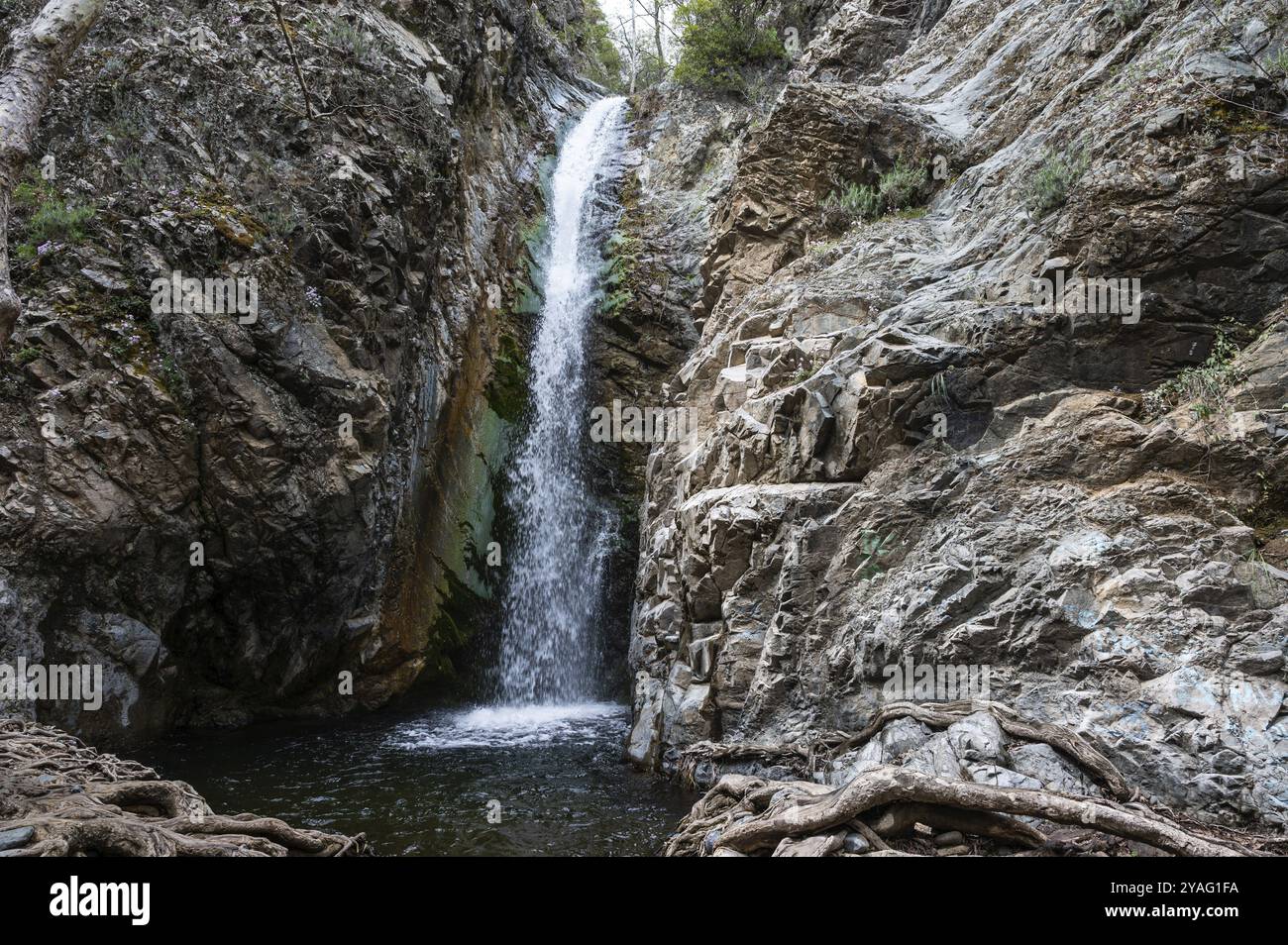 The Millomeris waterfall with rocks and splashing water, Pano Platres ...
