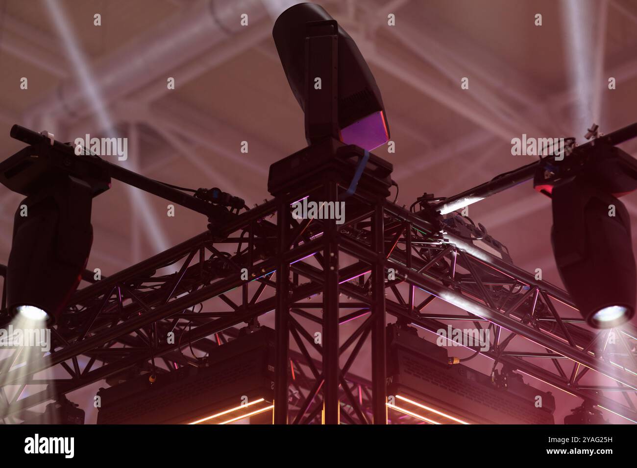 LED moving heads hanging on a box truss structure. Professional stage ...