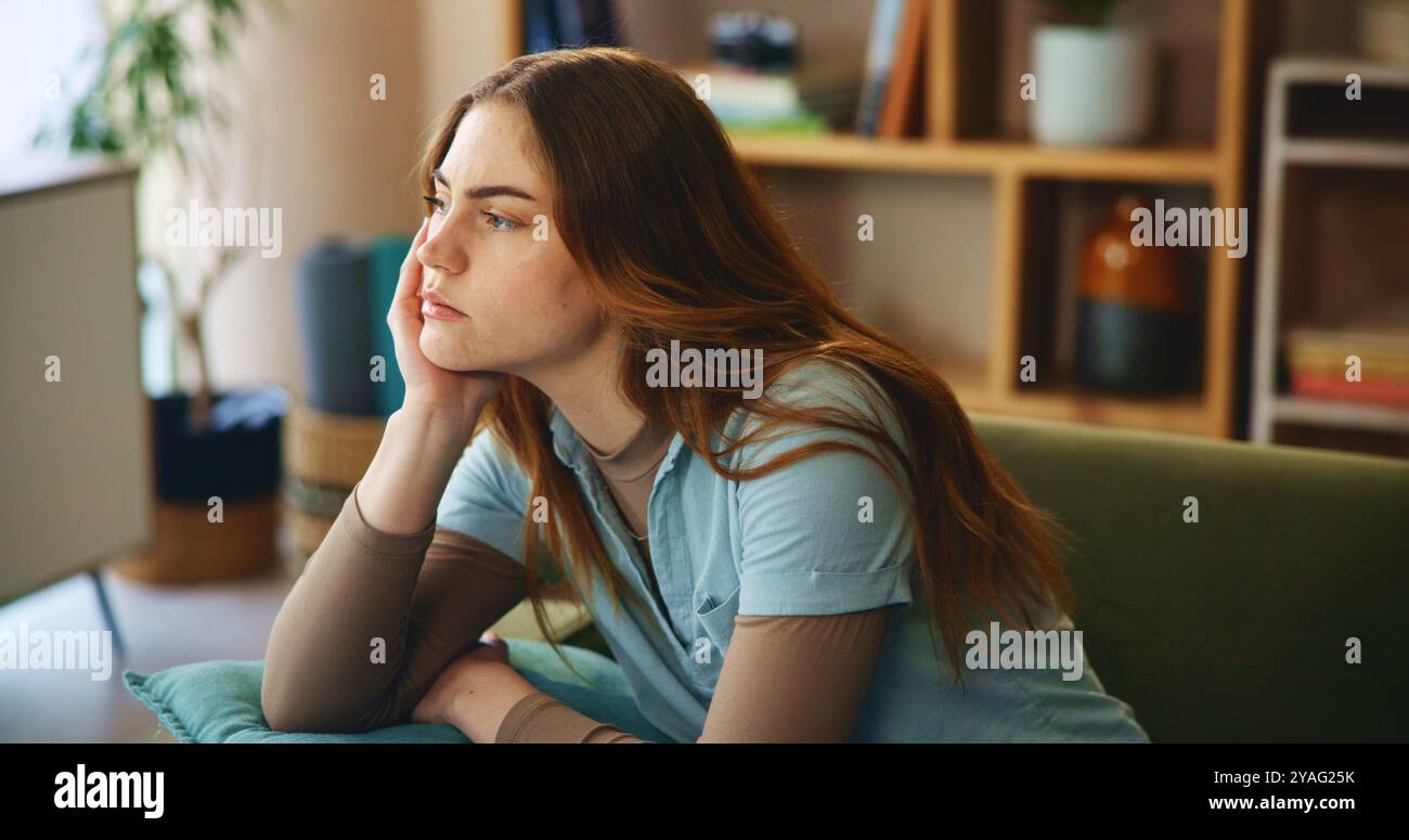 House, thinking and woman on sofa, stress and decision with depression ...