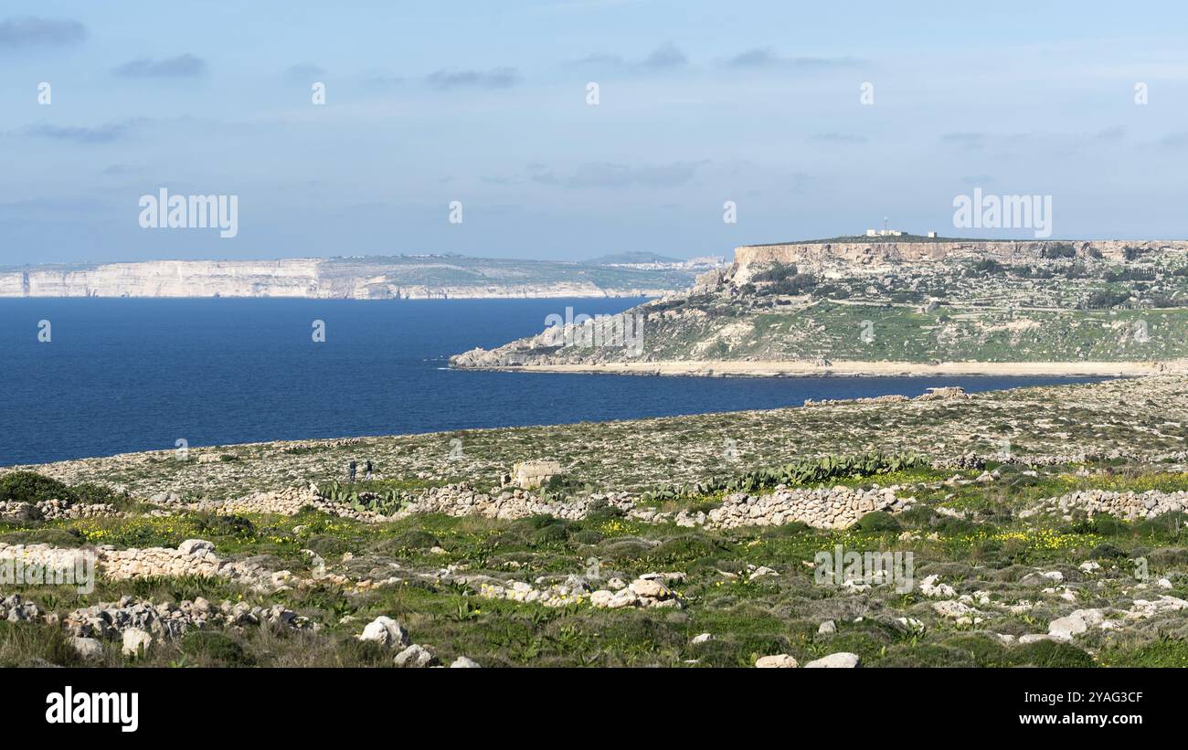 The green and blue coastal line with rocks, bays and mountains around ...