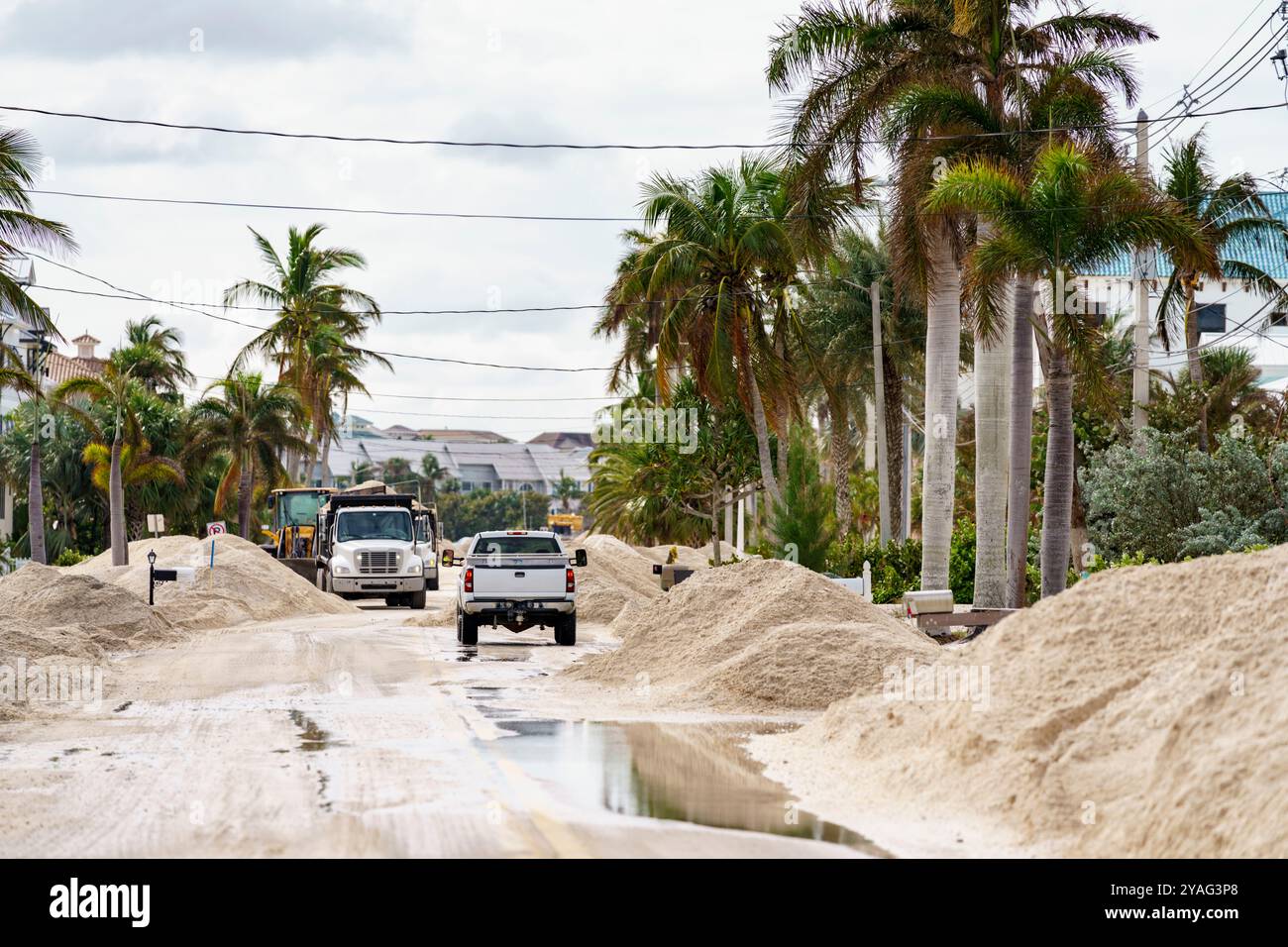 Stock photo dump trucks removing tons of sand from Bonita Beach Florida ...