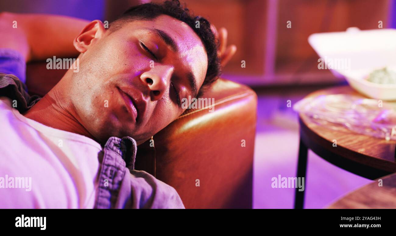 Drugs, overdose and person on sofa with sleep, health risk and narcotic ...