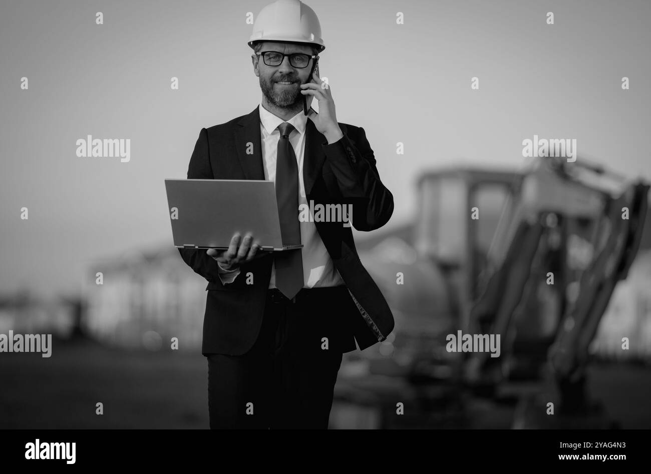 Civil engineer worker at a construction site. Mature engineer worker ...