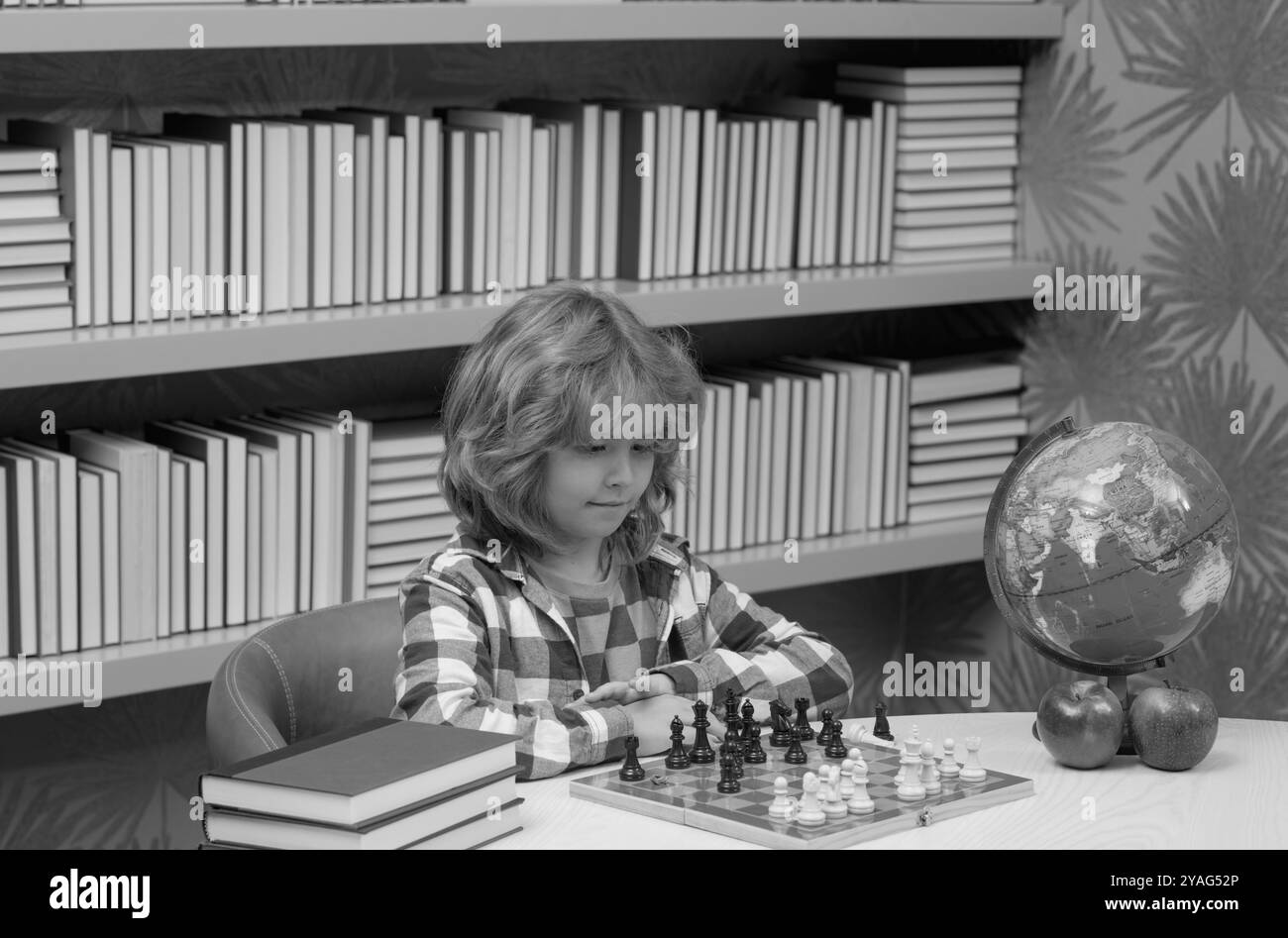 Child play chess in classroom at school. Chess for intelligent kid ...