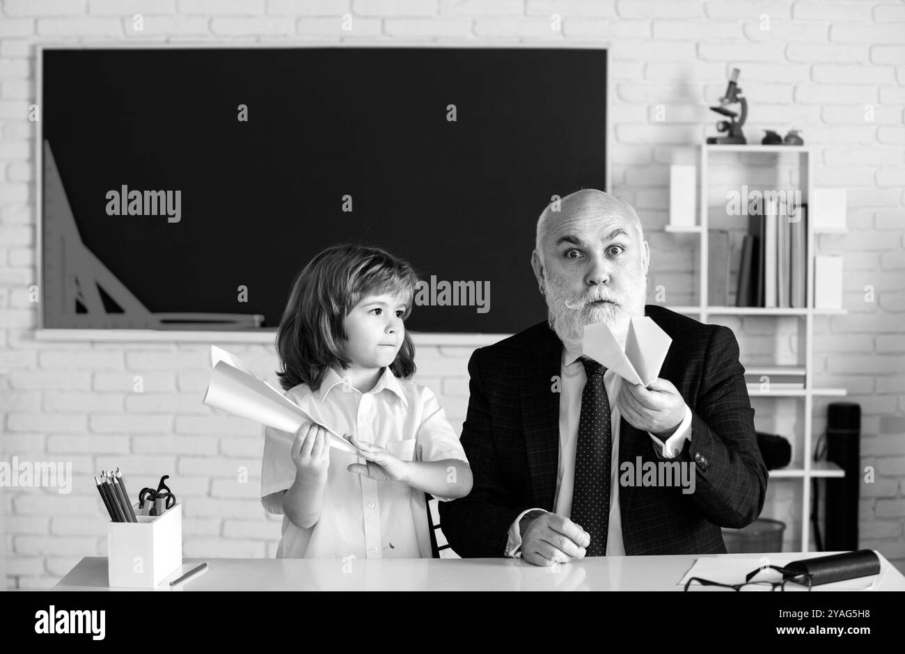 Happy kid in school break. Teacher with pupil with airplanes. Education ...