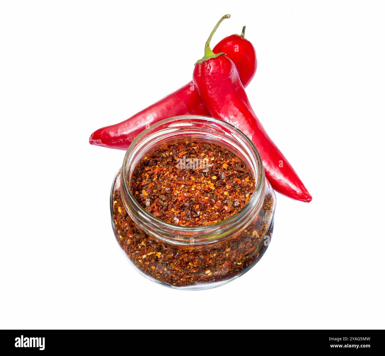 Paprika. Crushed red dried pepper in glass volume isolated on white ...