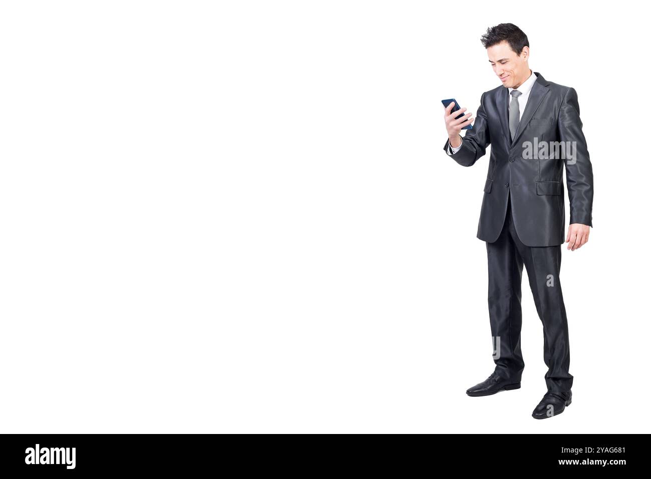 Content man in suit browsing smartphone. White background Stock Photo ...
