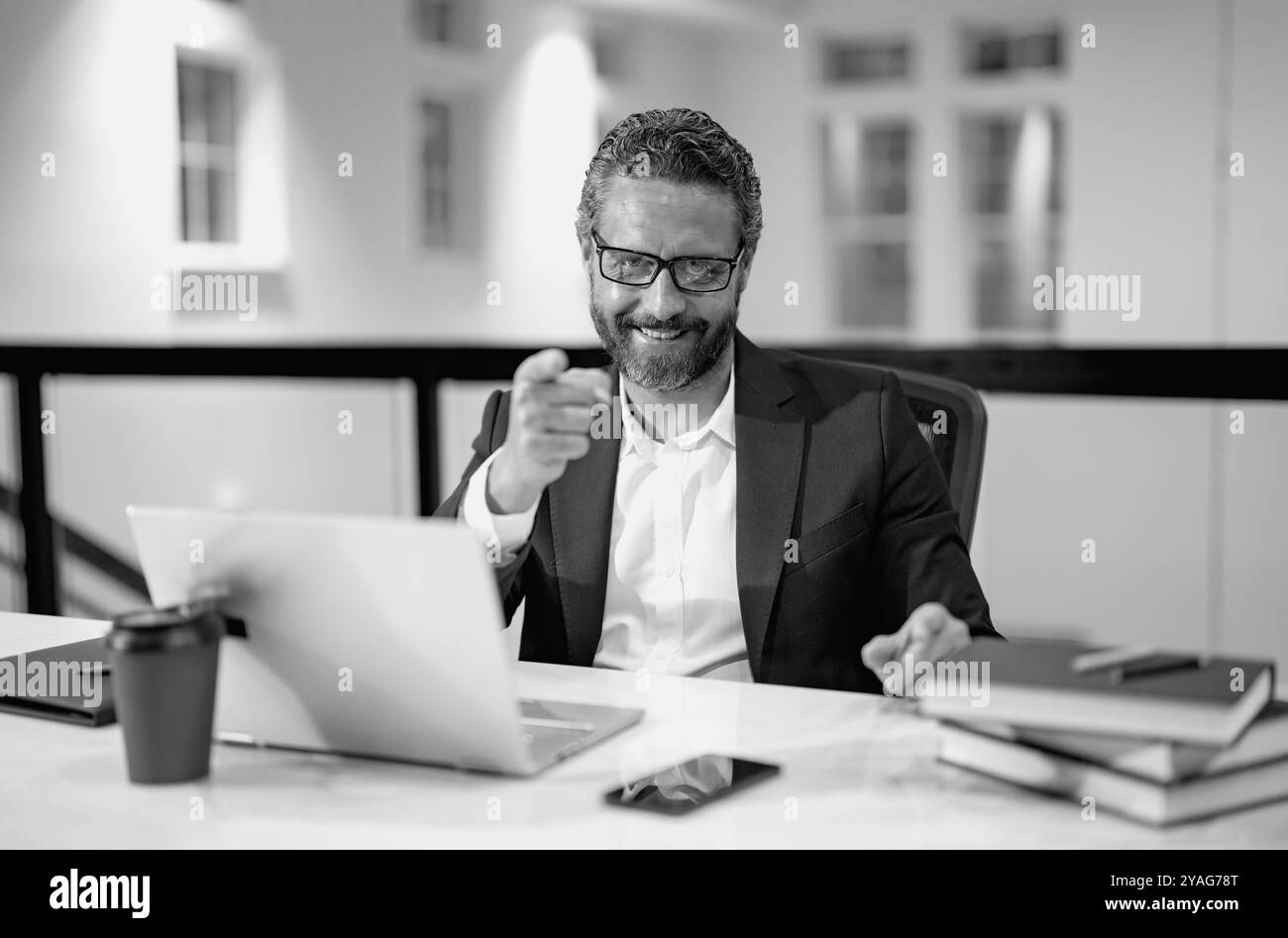 Middle aged businessman working with laptop in office. Hispanic ...