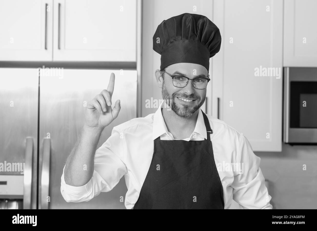 Idea for food. Man in chef hat cooking on kitchen Stock Photo - Alamy