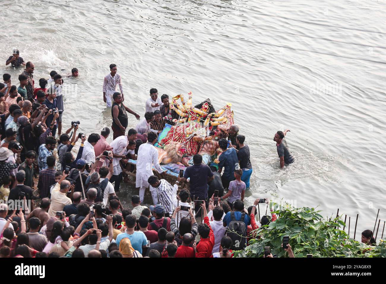 Durga Puja festival in Dhaka Bangladeshi Hindu devotees immerse an idol ...
