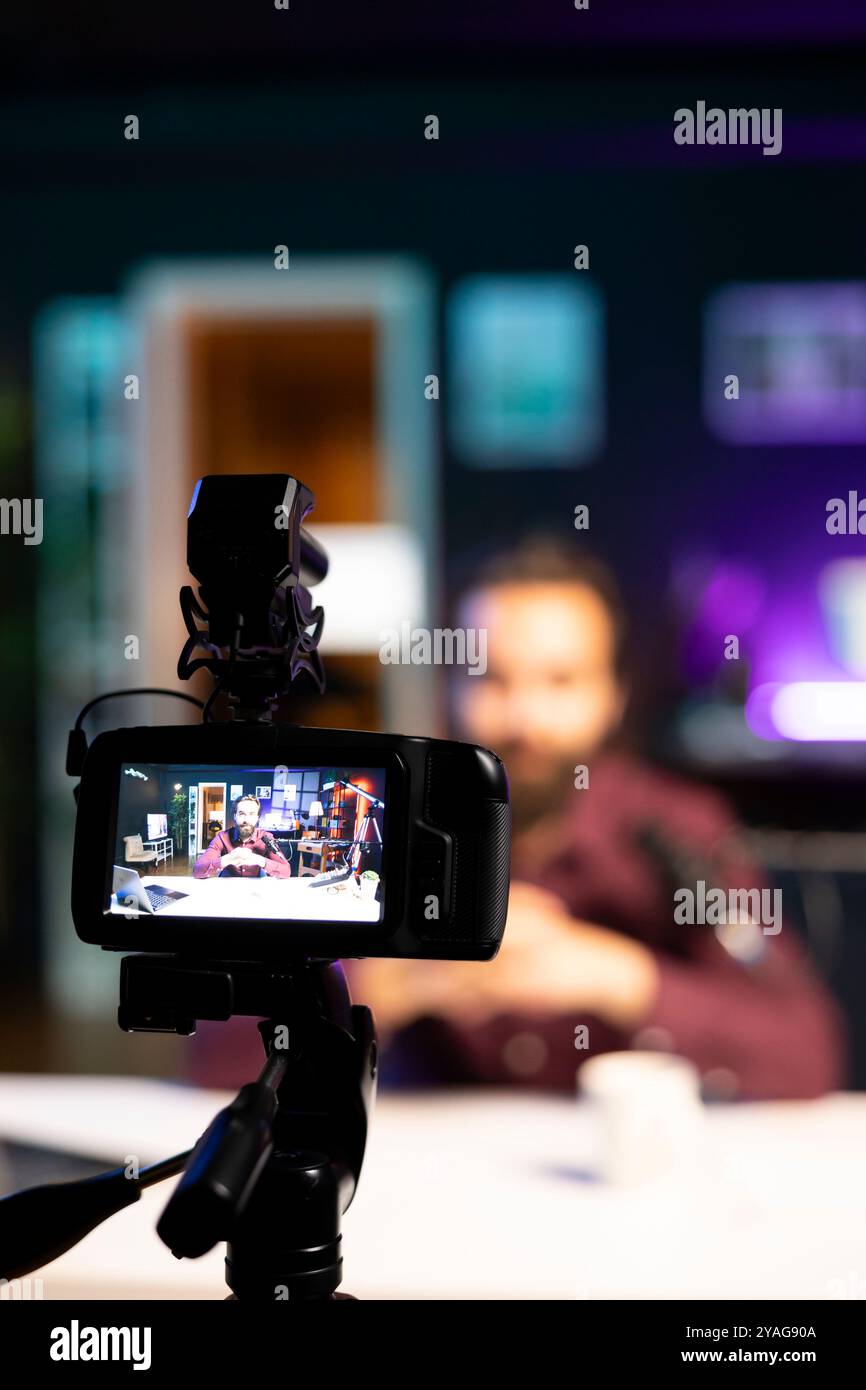 Focus on professional camera used by content creator in blurry ...