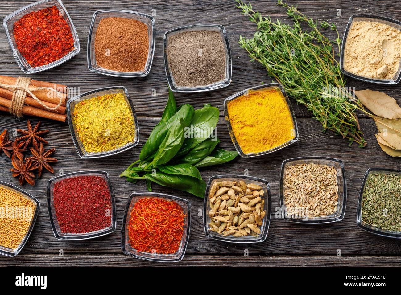 A vibrant assortment of various spices and herbs displayed together ...