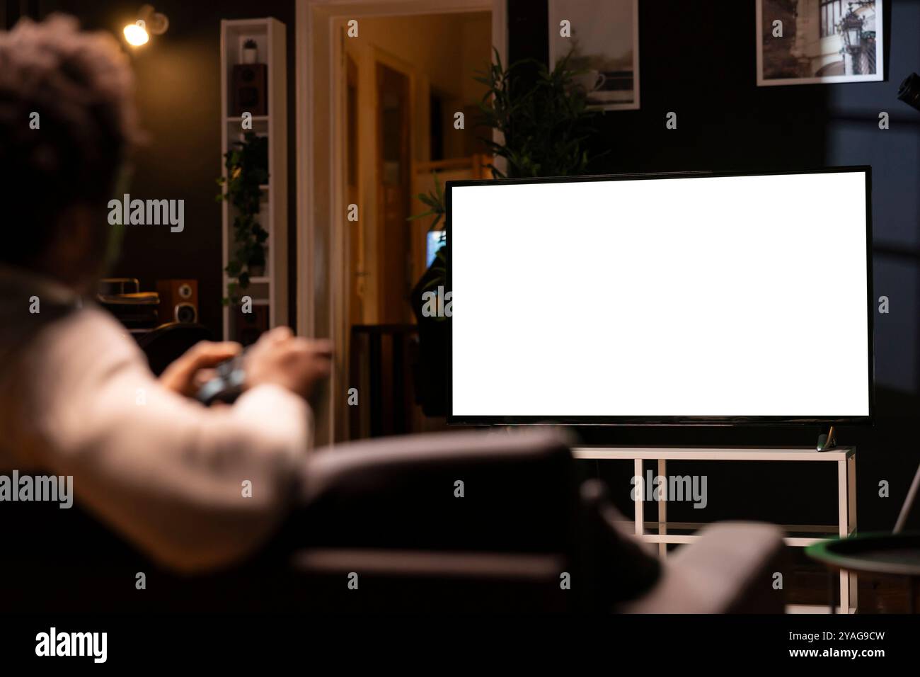 Man holding controller in apartment, playing videogames on isolated ...