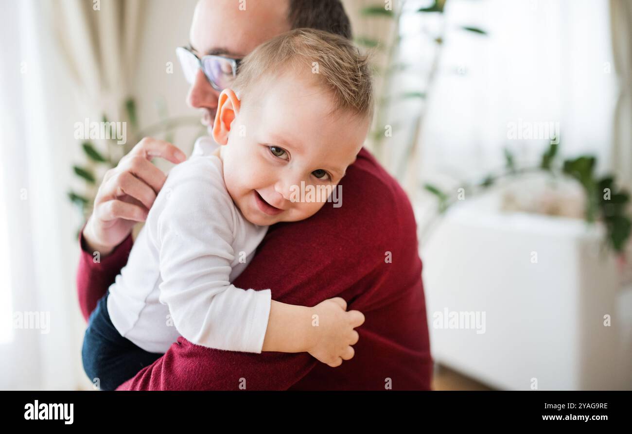 Portrait of father with little son. Dad holding little boy and hugging ...